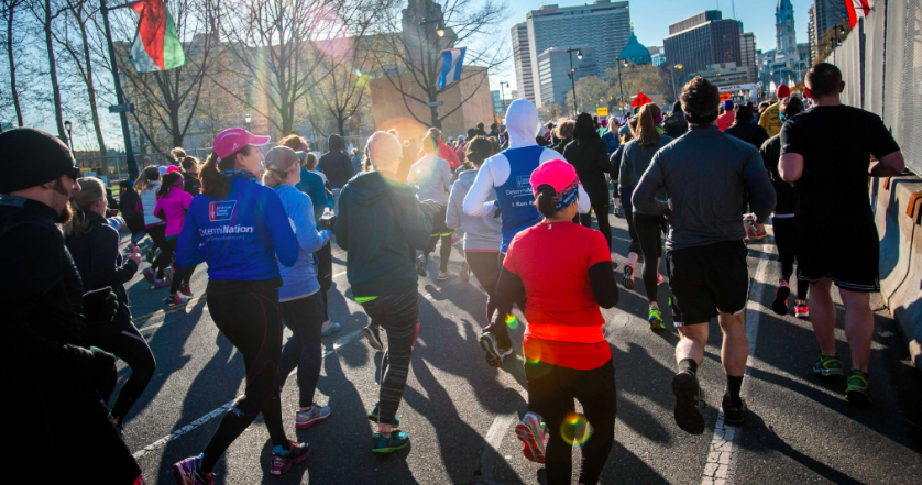 WATCH: Runners carry fatigued woman to finish line of Philly half ...